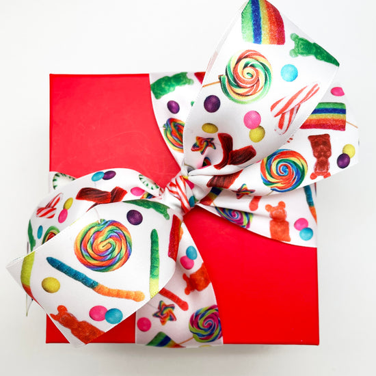 Candy theme ribbon with lollipops, gummy bears, and mints in rainbow ...